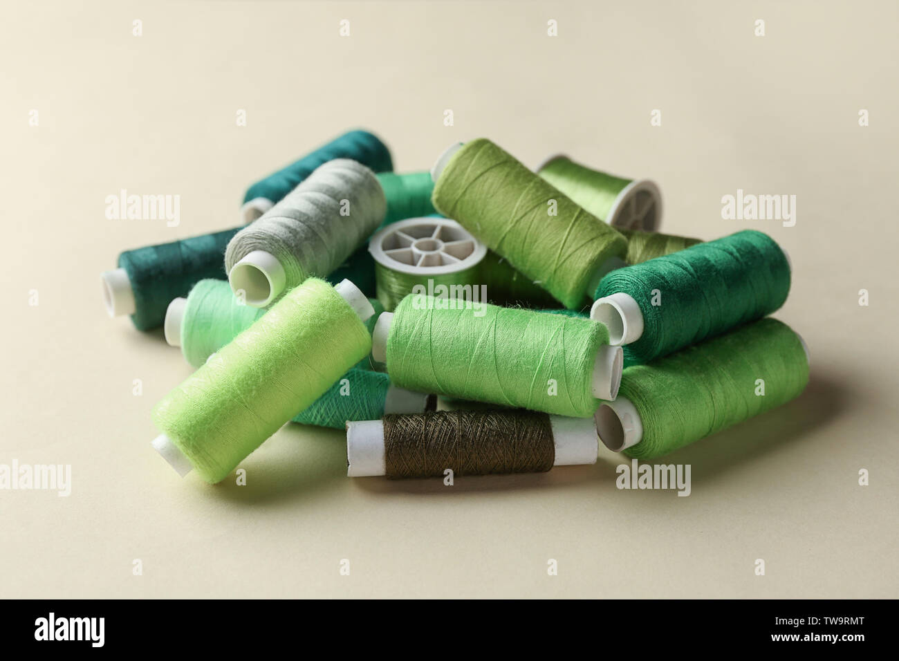 Set of sewing threads on light background Stock Photo - Alamy