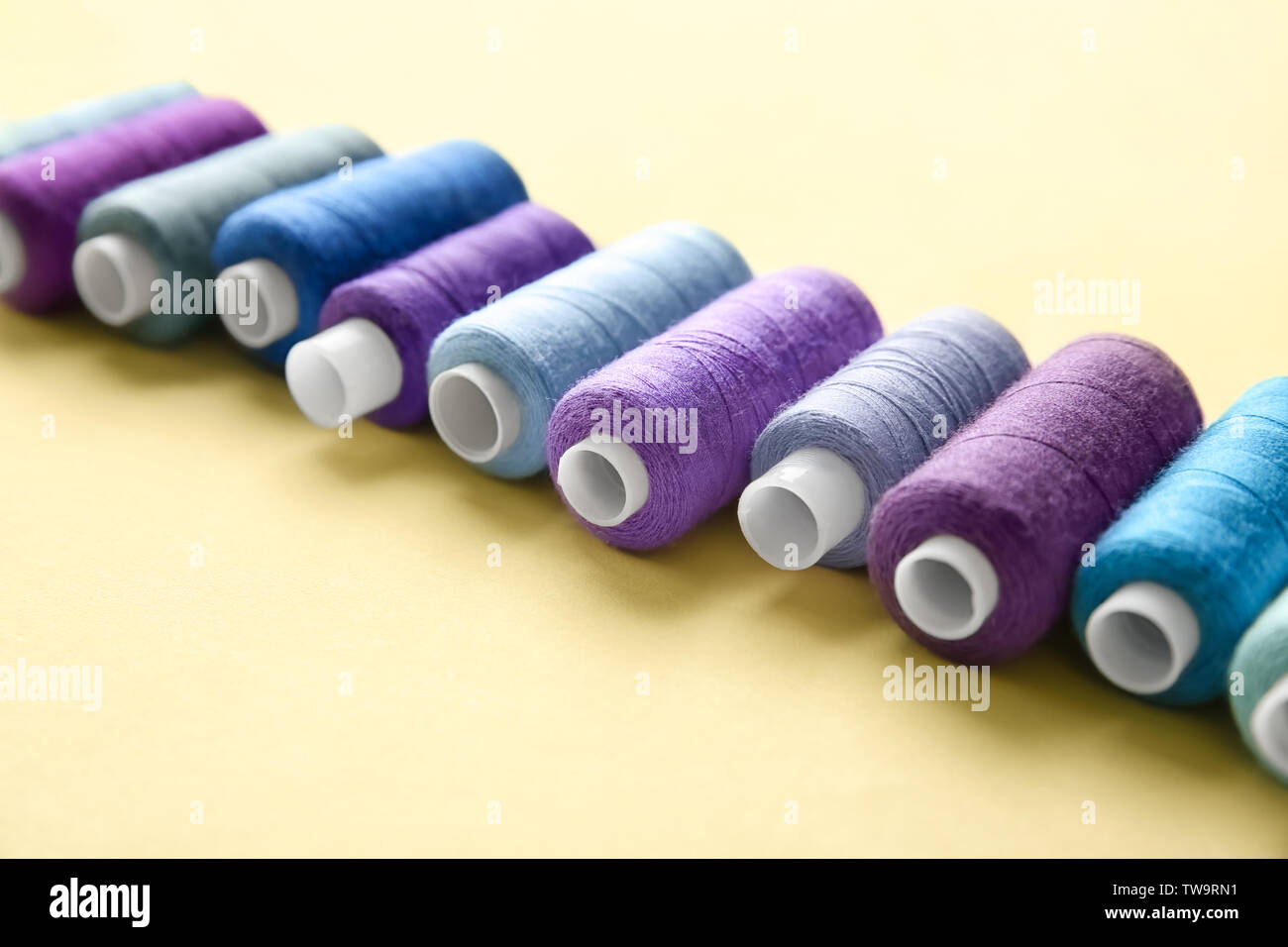 Set of sewing threads on light background Stock Photo - Alamy