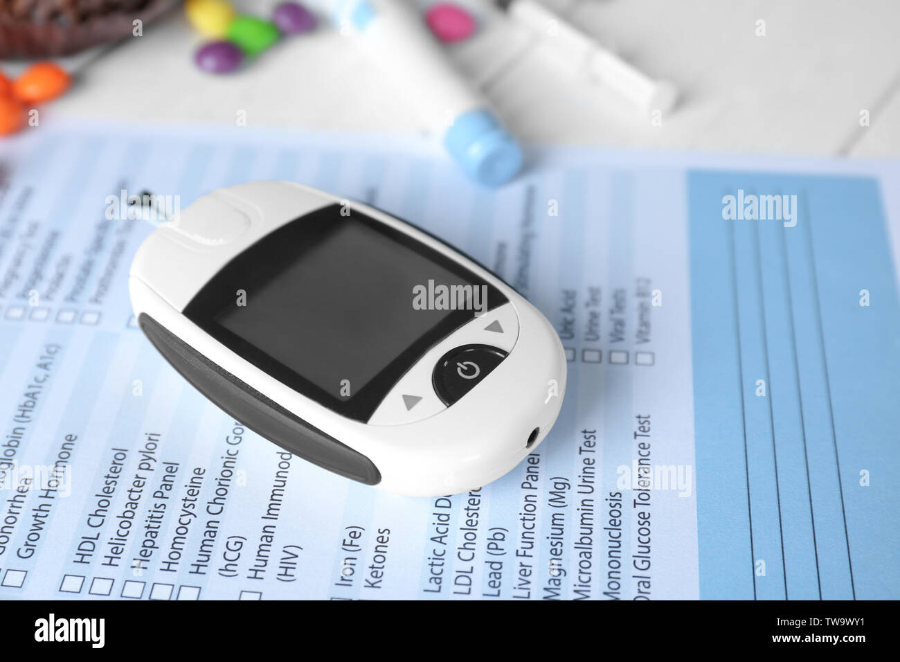 Digital glucometer on test form. Diabetes concept Stock Photo - Alamy