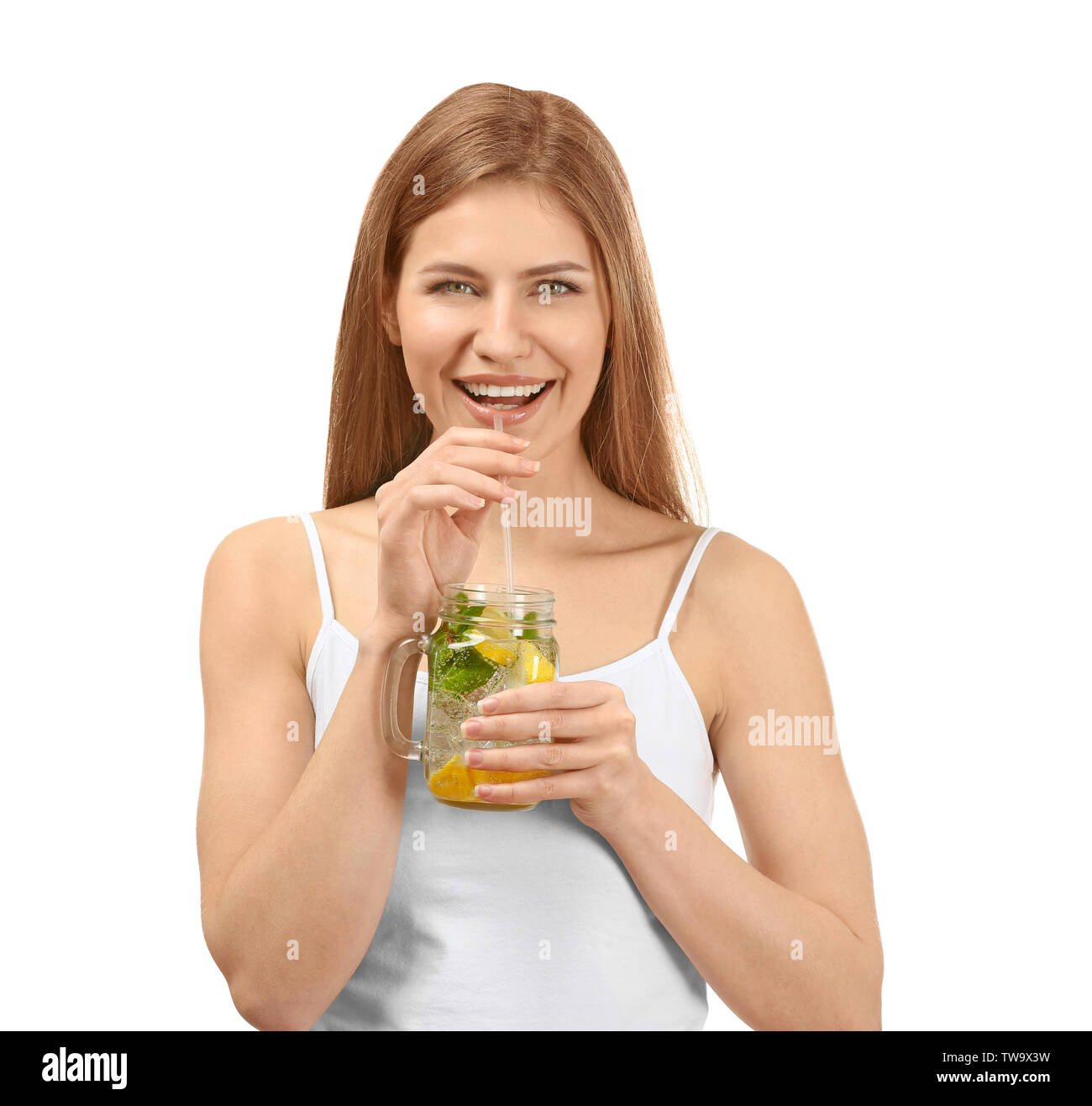 Beautiful young woman drinking fresh lemonade on white background Stock ...