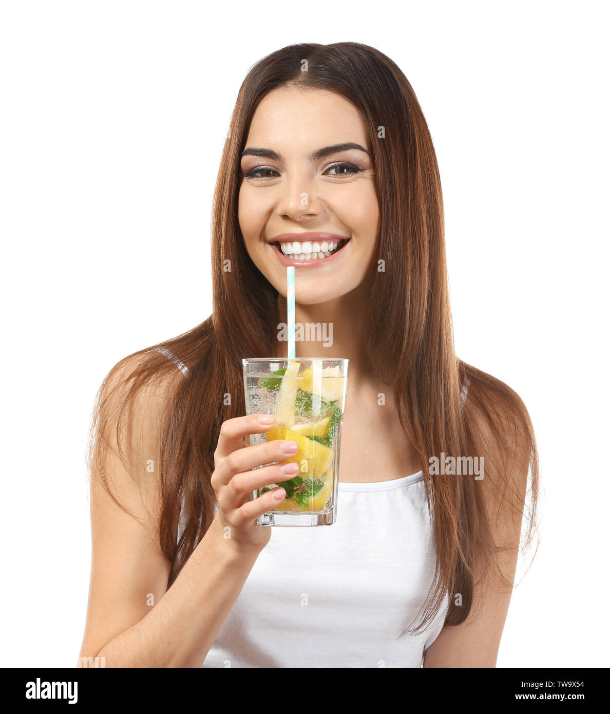 Beautiful young woman drinking lemonade on white background Stock Photo ...