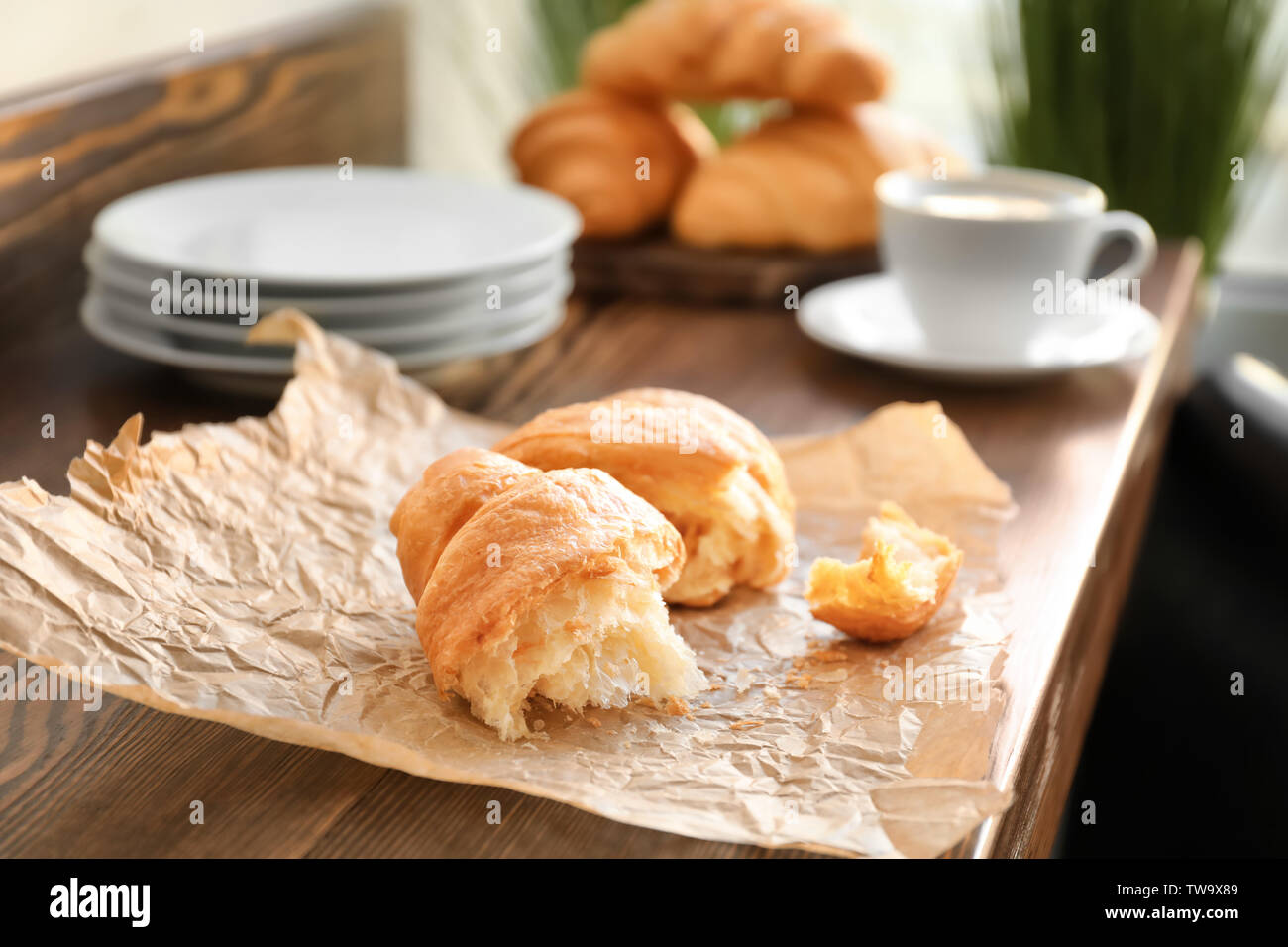 Delicious croissant on paper Stock Photo - Alamy