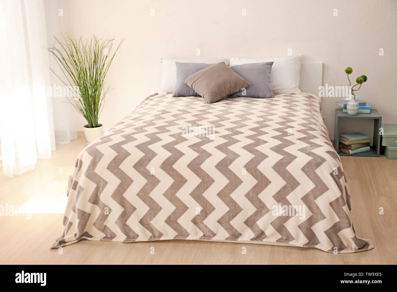 Interior of modern room with comfortable bed Stock Photo - Alamy