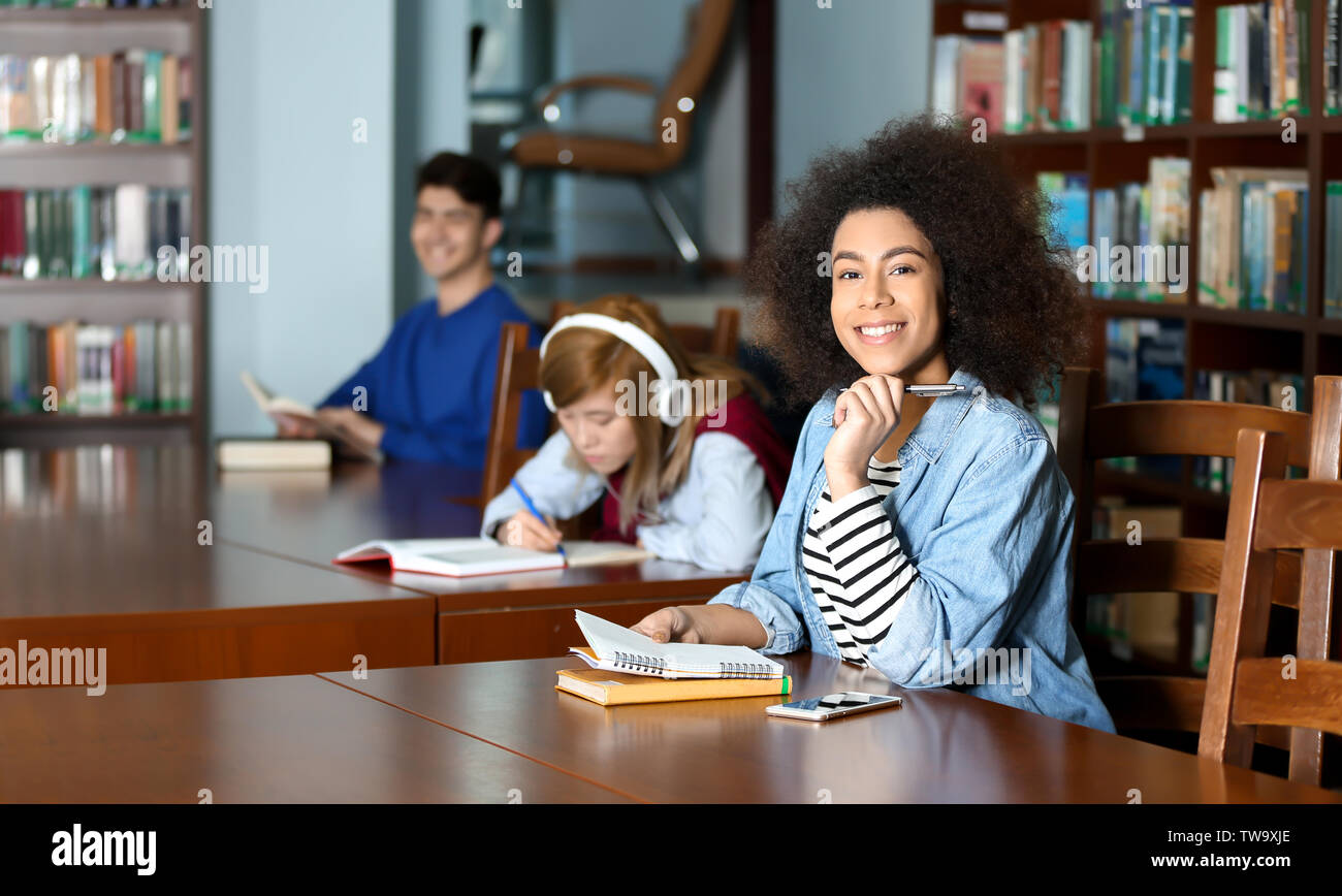 African American student studying in library Stock Photo - Alamy
