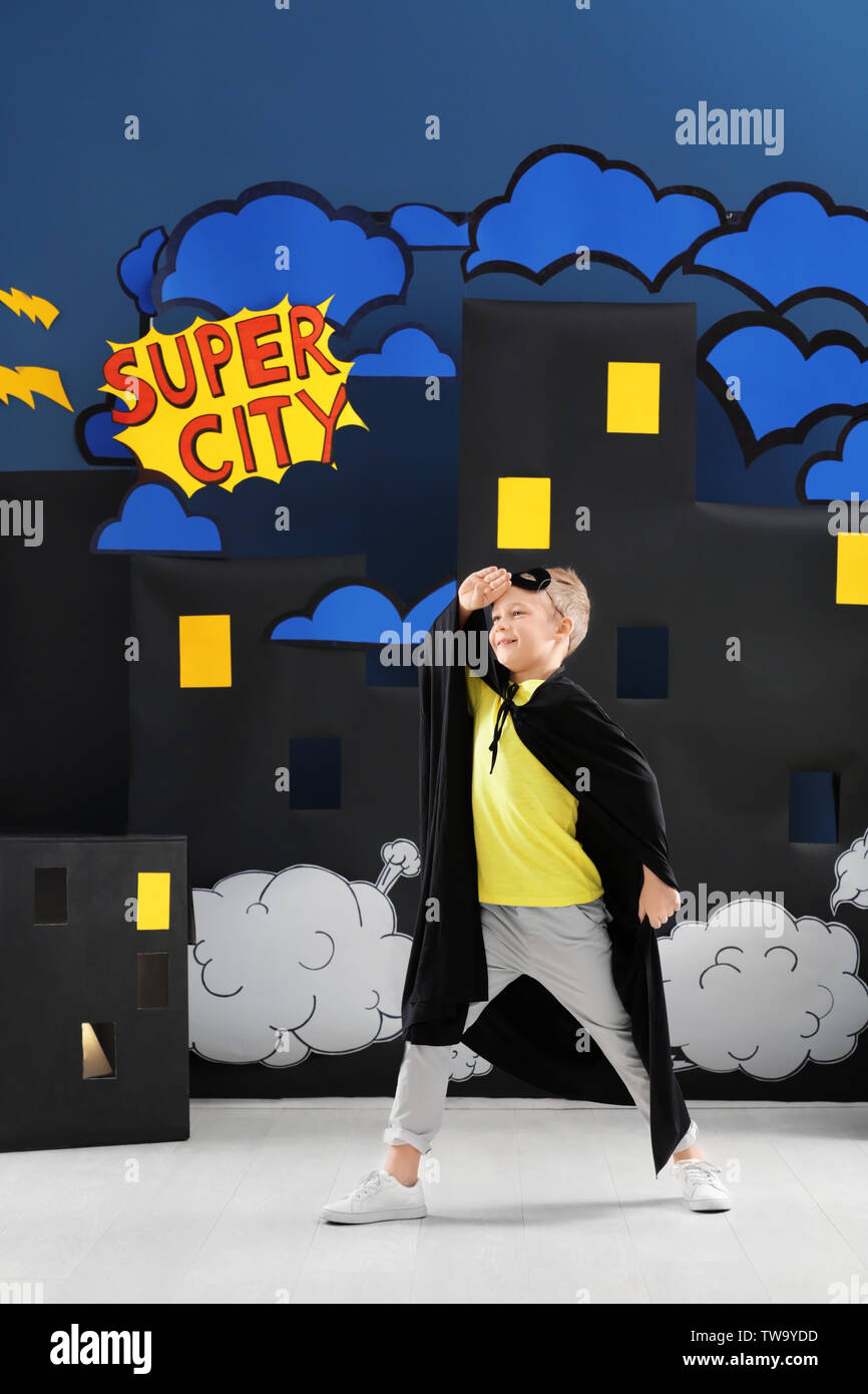 Cute boy as superhero against decoration. Comic strip city theme Stock ...