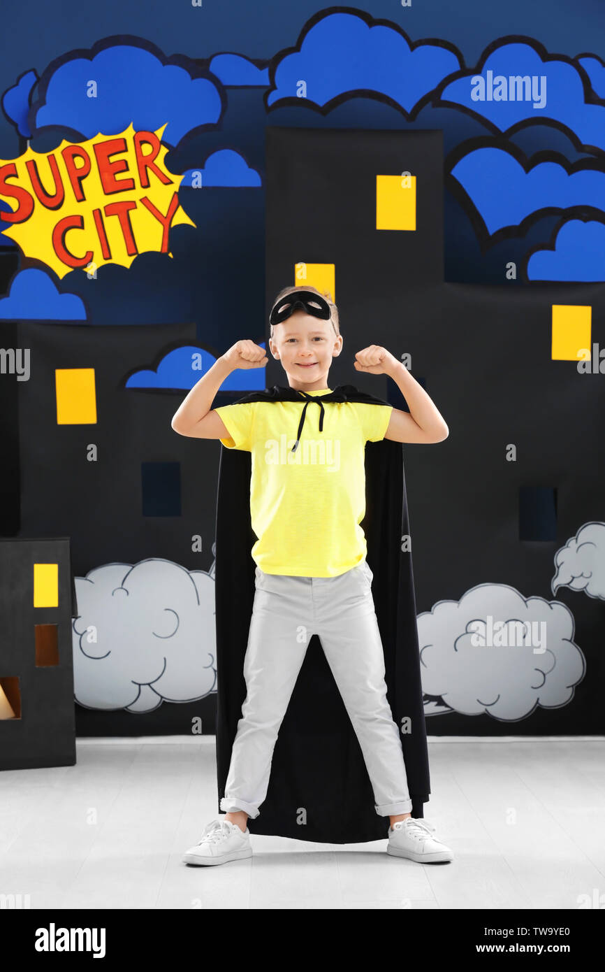 Cute boy as superhero against decoration. Comic strip city theme Stock ...