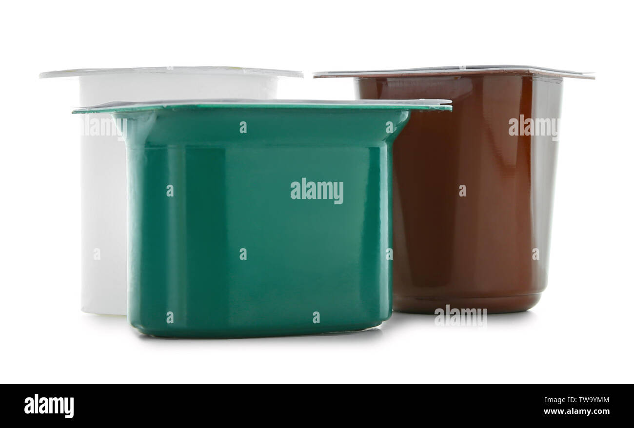 Plastic cups with yogurt on white background Stock Photo - Alamy