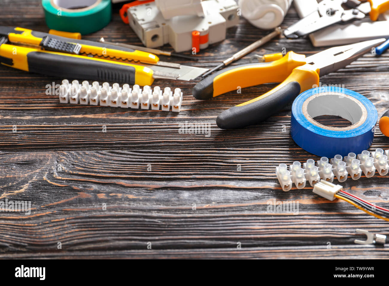 Different electrical tools on wooden background Stock Photo - Alamy