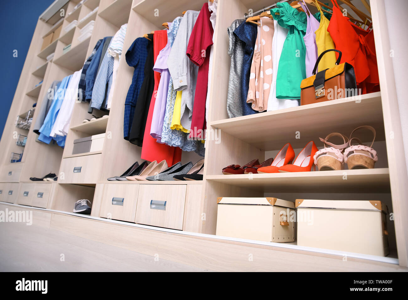 Big wardrobe with different clothes for dressing room Stock Photo - Alamy