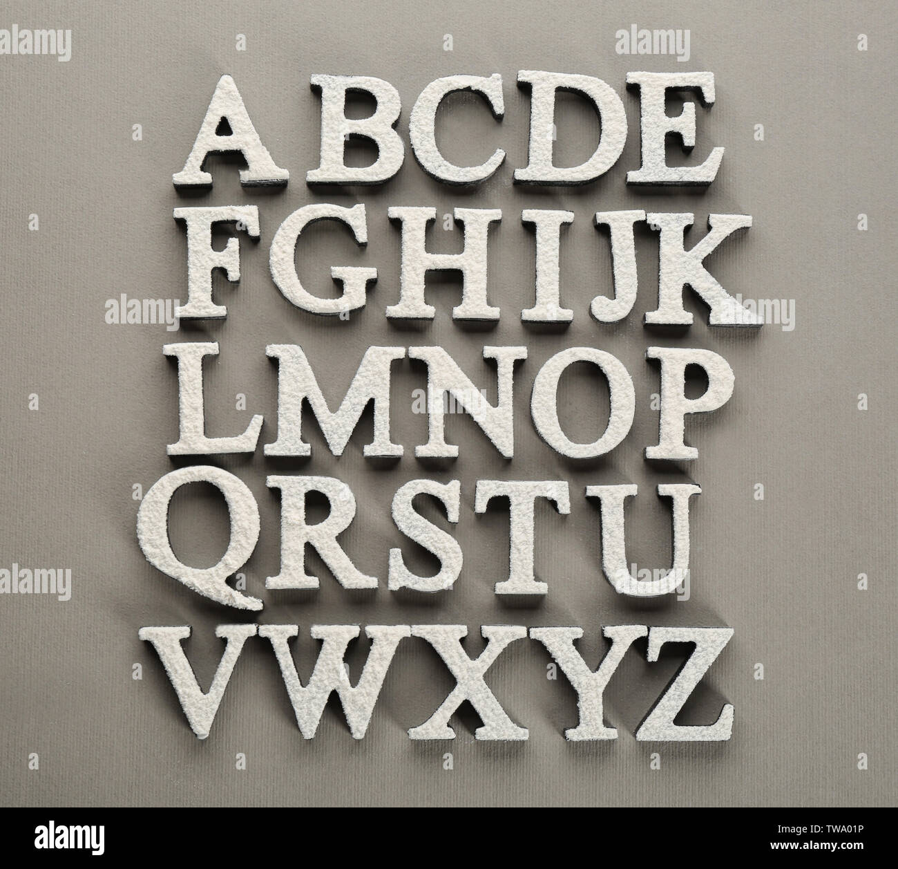 Floured alphabet letters on light background Stock Photo - Alamy