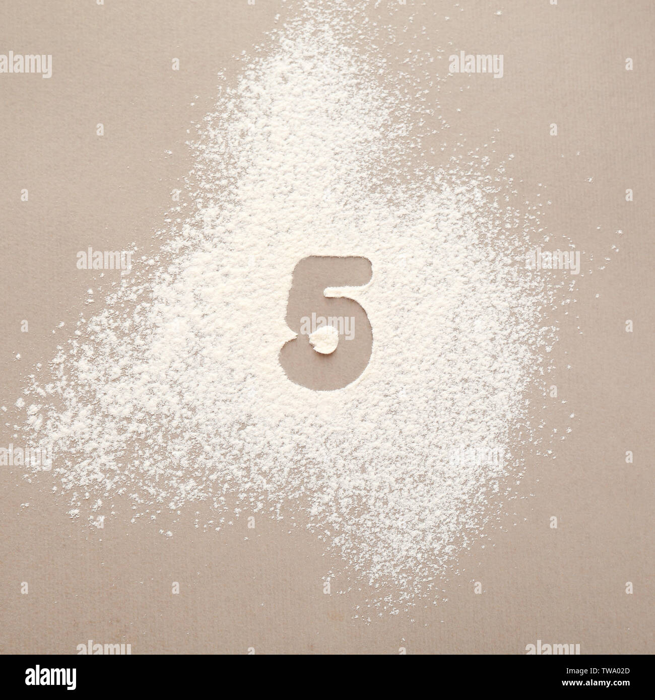 Silhouette of figure 5 on scattered flour Stock Photo - Alamy