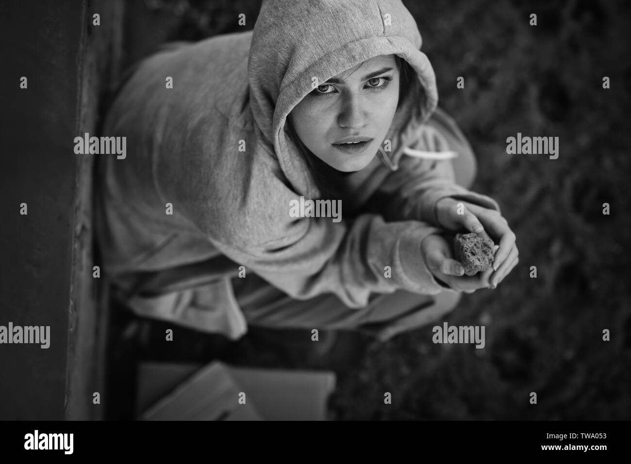 Homeless young woman asking help Black and White Stock Photos & Images ...