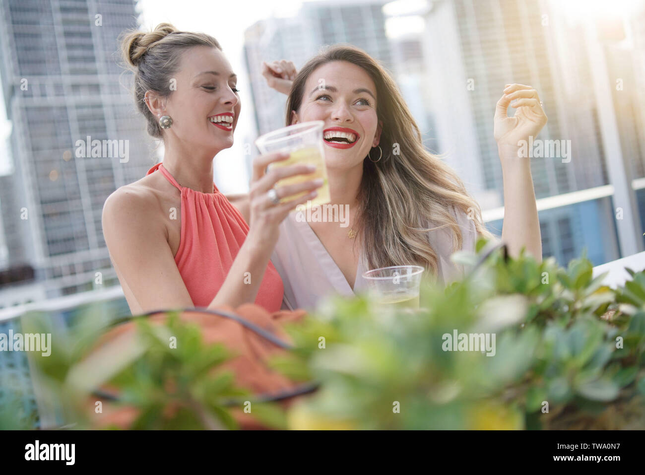 Two friends laughing night city hi-res stock photography and images - Alamy