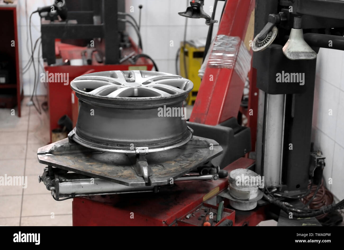Alloy wheel in workshop of modern tire store Stock Photo - Alamy