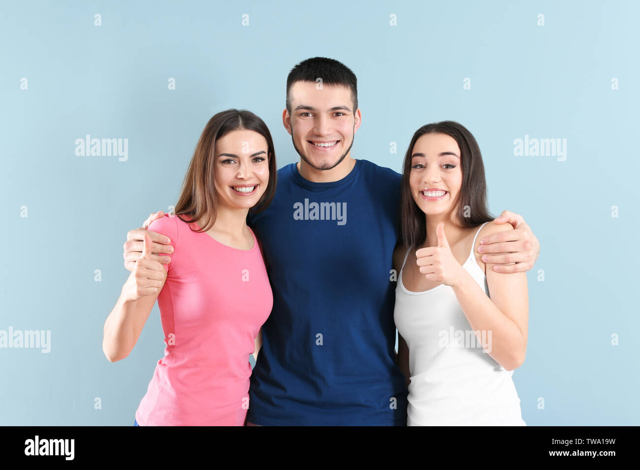 Young people posing together on color background. Unity concept Stock ...