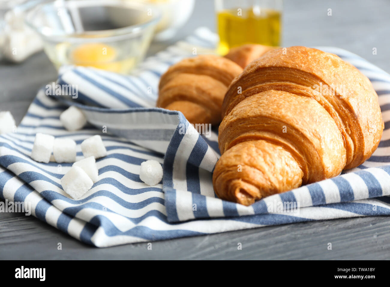 Tasty croissants and sugar on table Stock Photo - Alamy