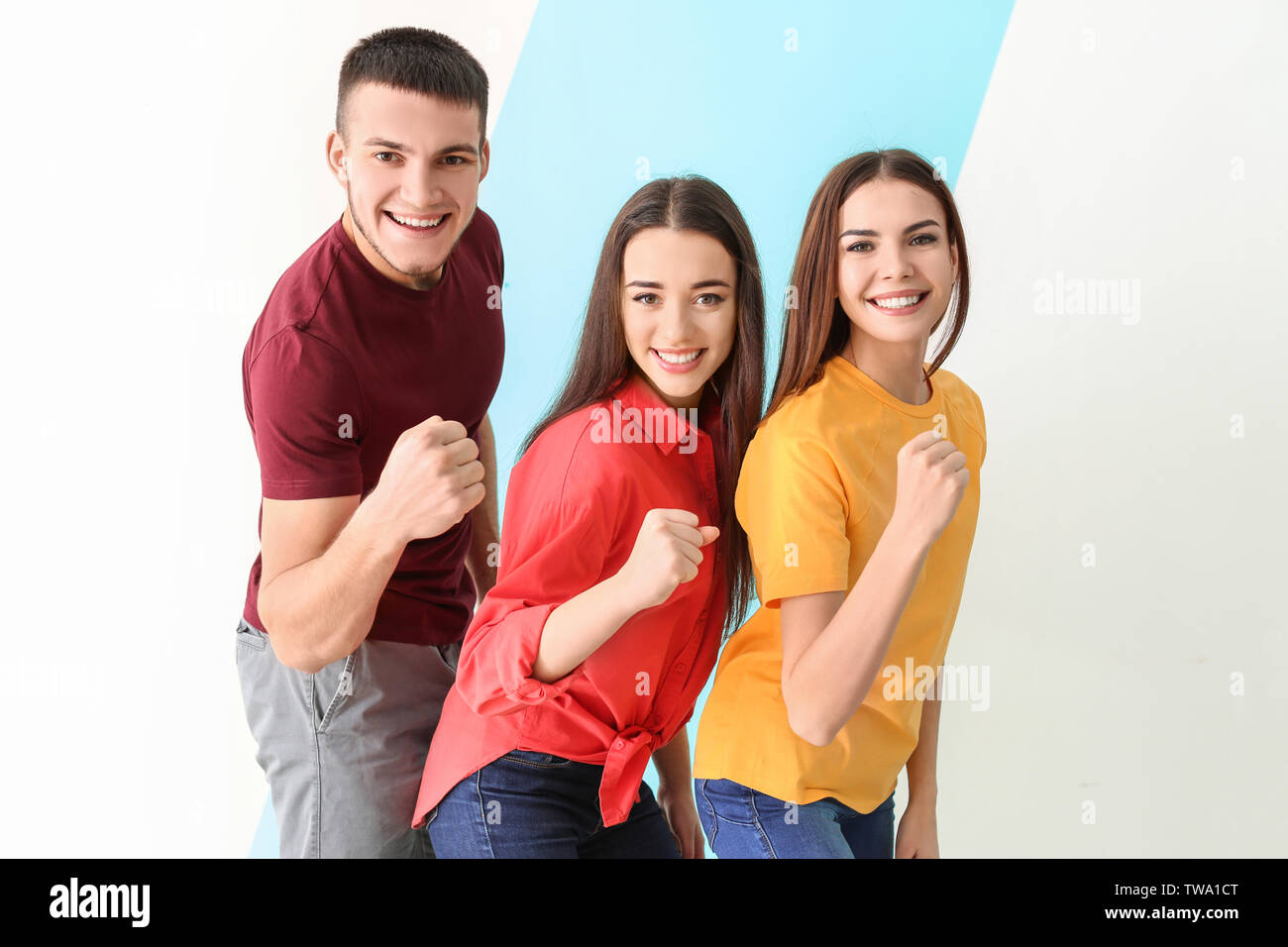 Young people posing together on color background. Unity concept Stock ...