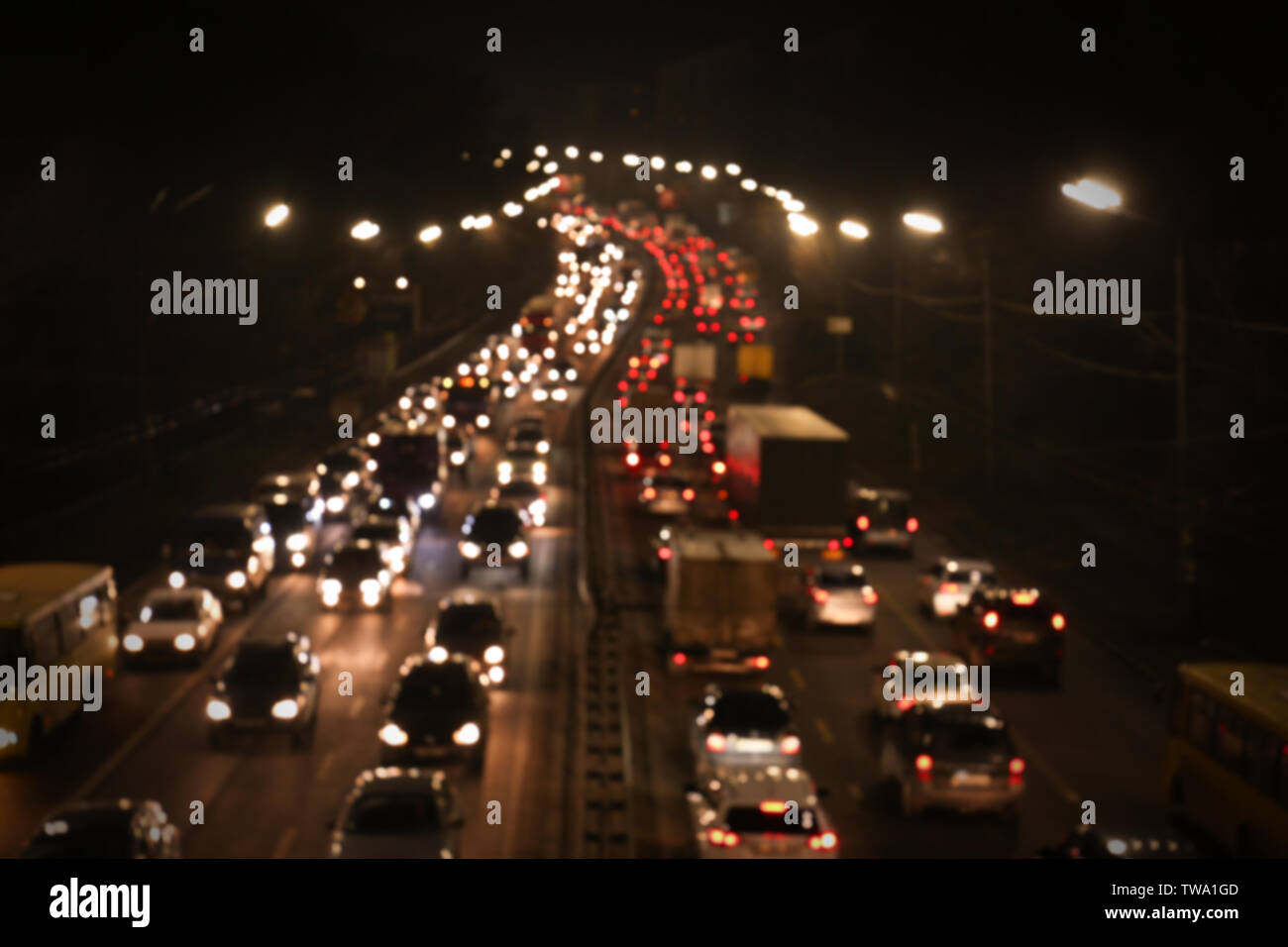 Blurred view of traffic jam at night city Stock Photo - Alamy
