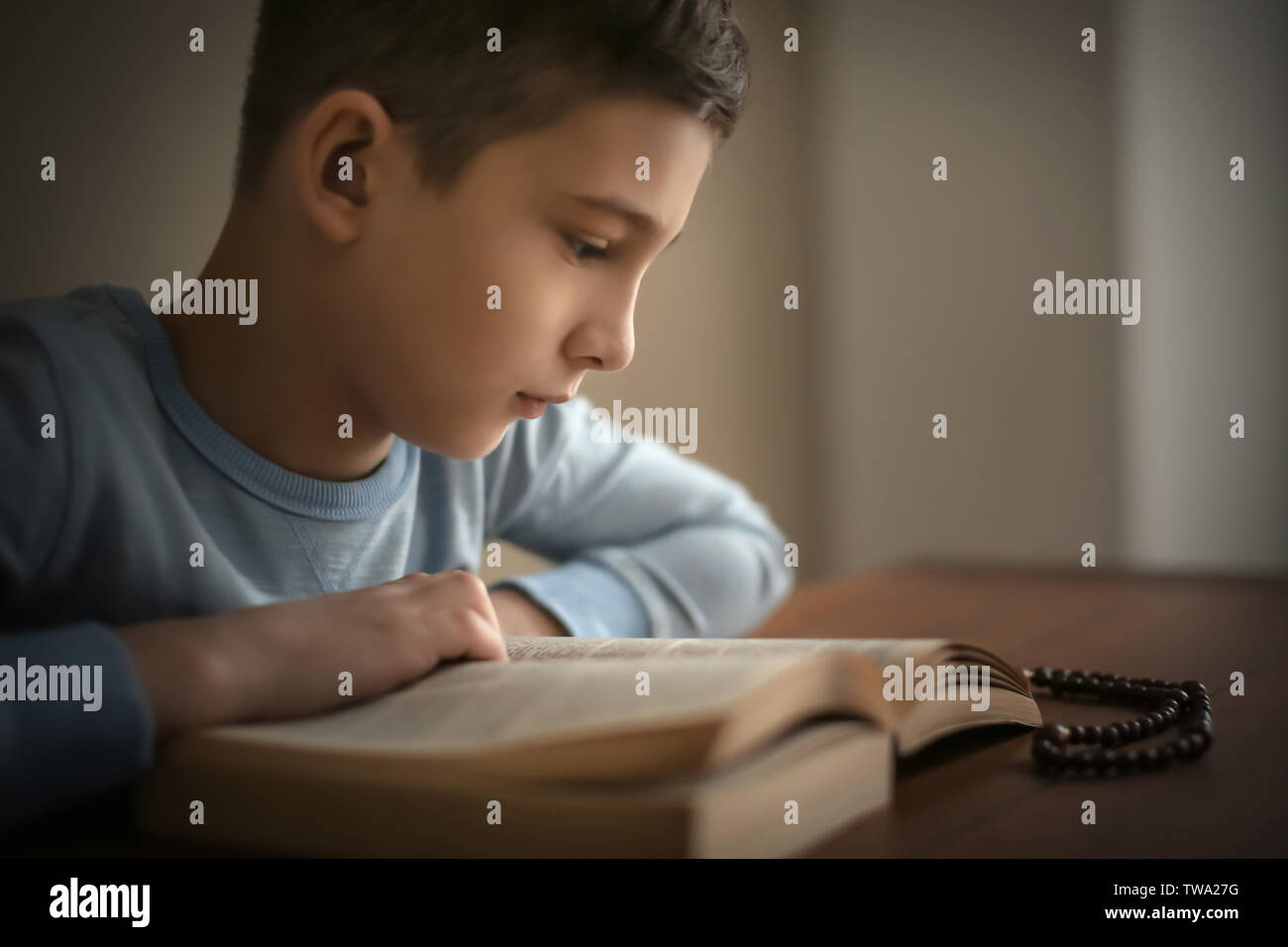 Boy reading bible hi-res stock photography and images - Alamy
