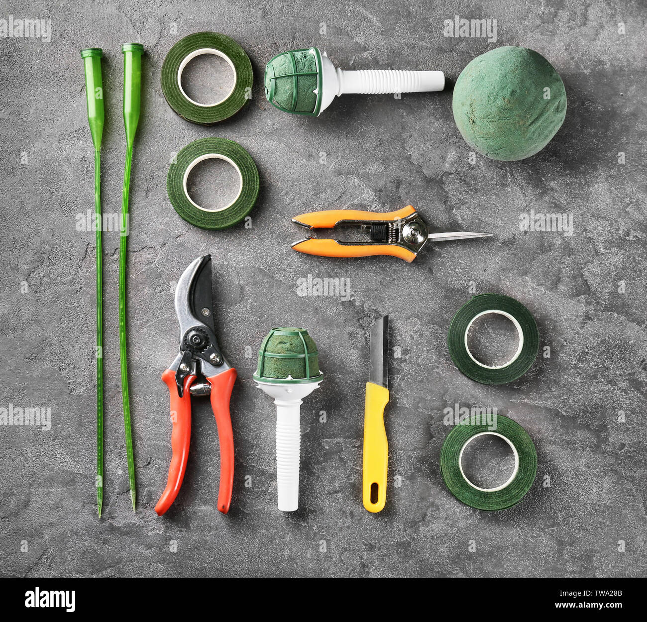 Florist equipment on grey background Stock Photo - Alamy