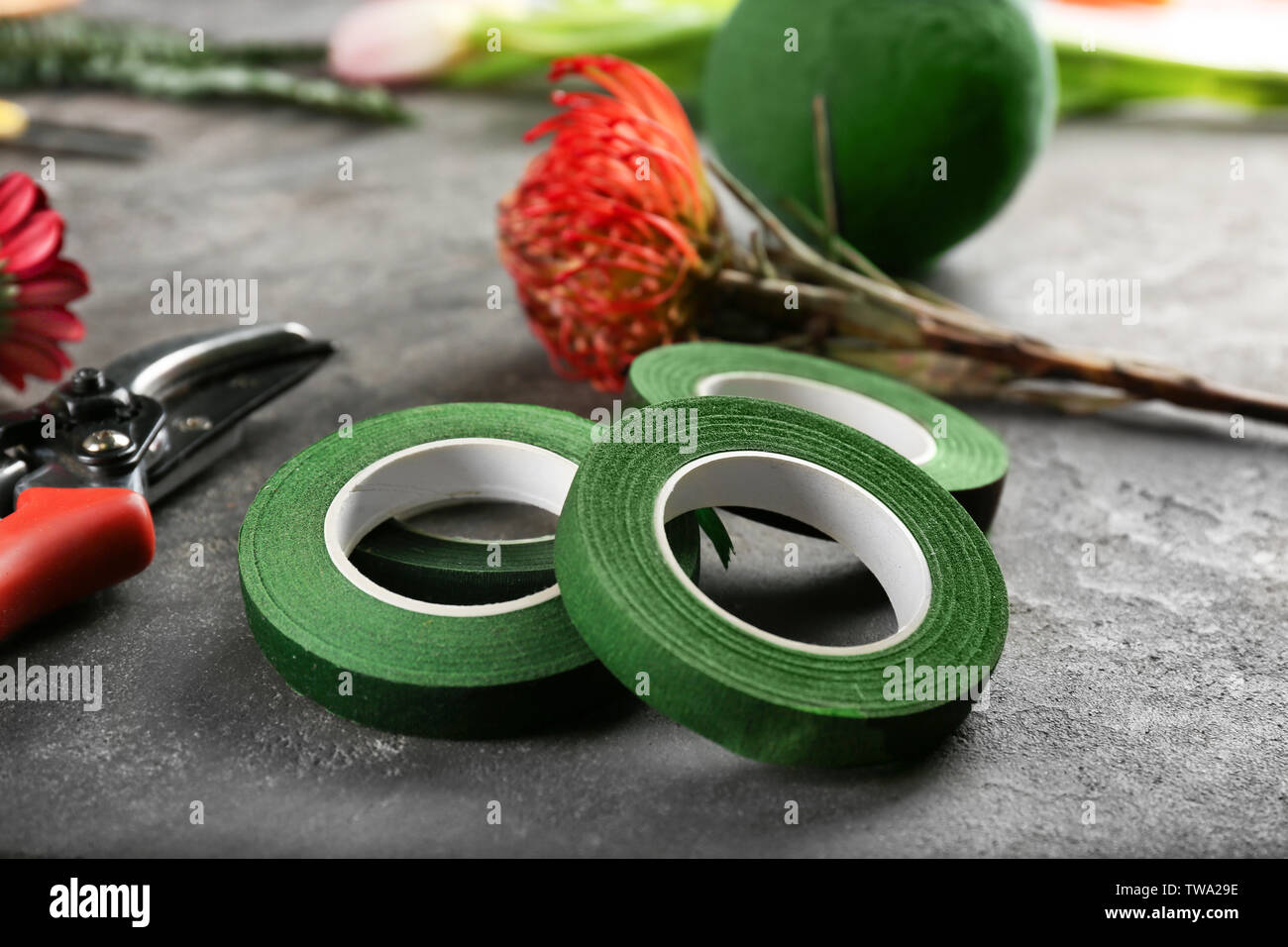 Florist equipment on grey background Stock Photo - Alamy