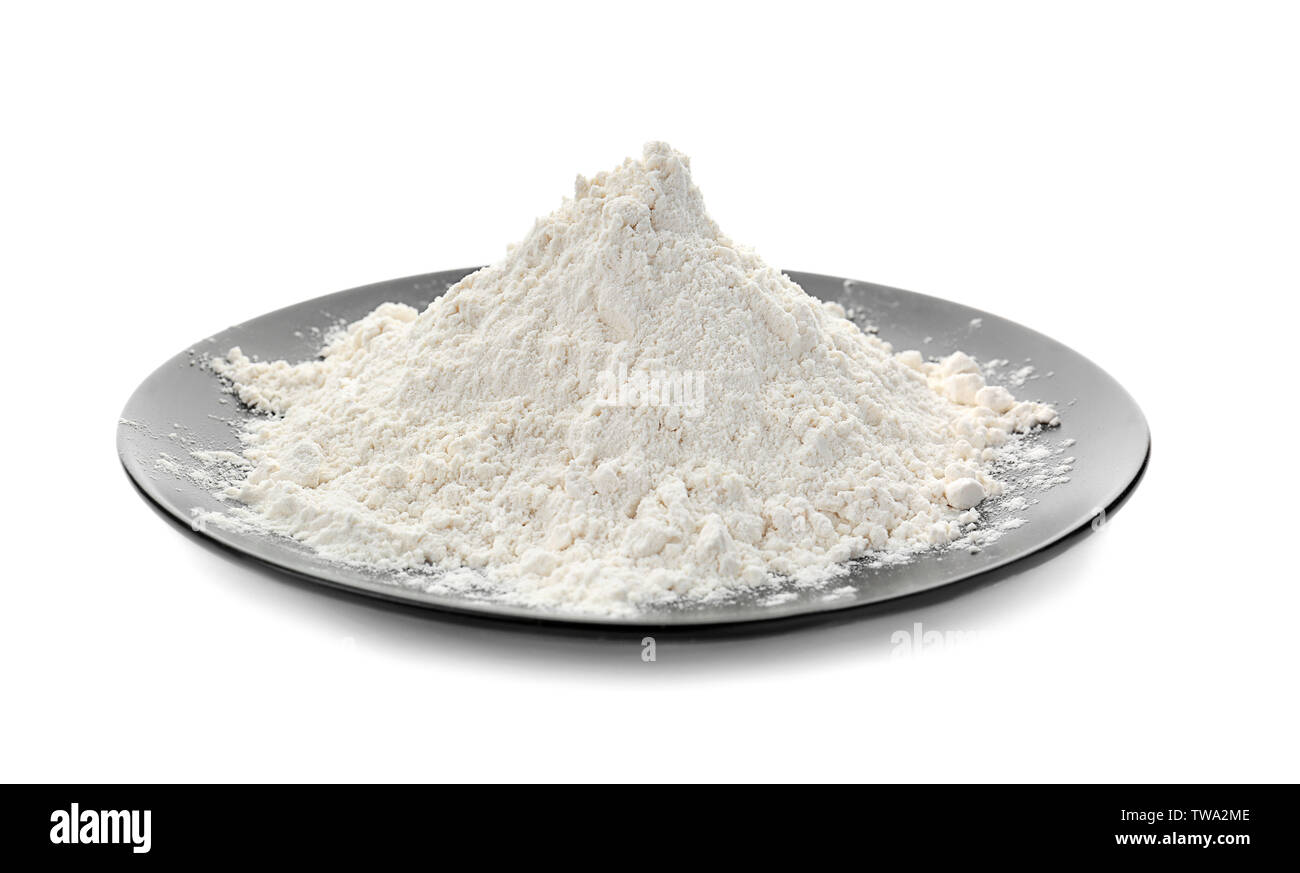 Plate with wheat flour on white background Stock Photo - Alamy