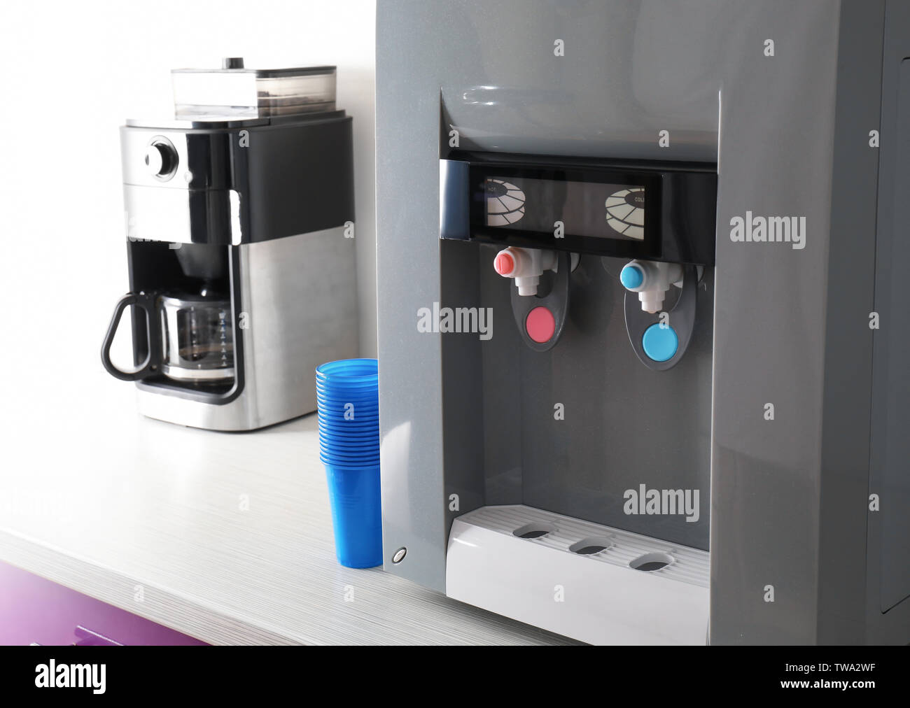 Water cooler on table in office, closeup Stock Photo - Alamy
