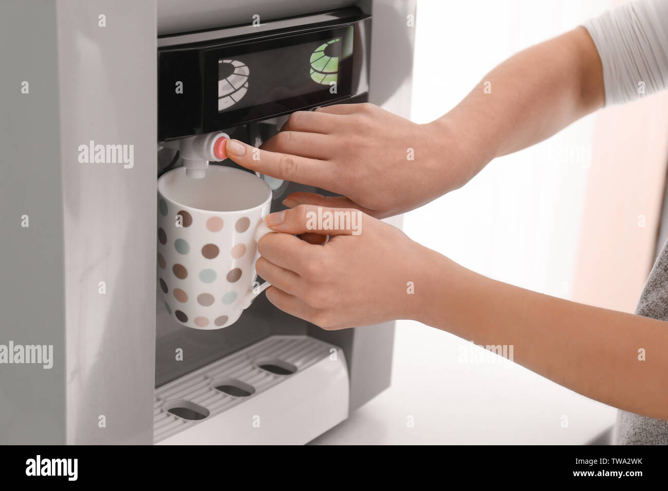 Filling cup water from dispenser hi-res stock photography and images ...