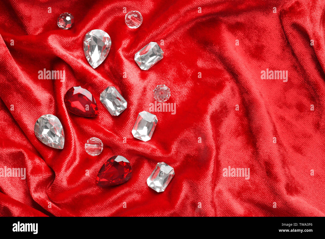 Precious stones for jewellery on red velvet Stock Photo - Alamy