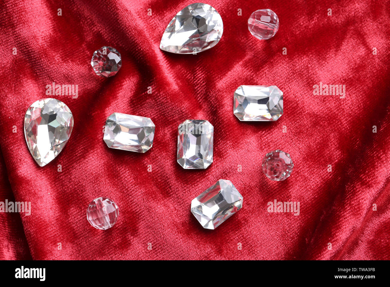 Precious stones for jewellery on red velvet Stock Photo - Alamy