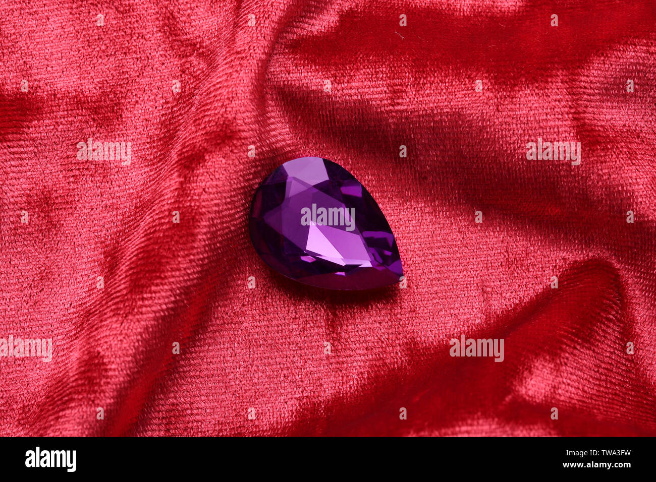 Precious stone for jewellery on red velvet Stock Photo - Alamy