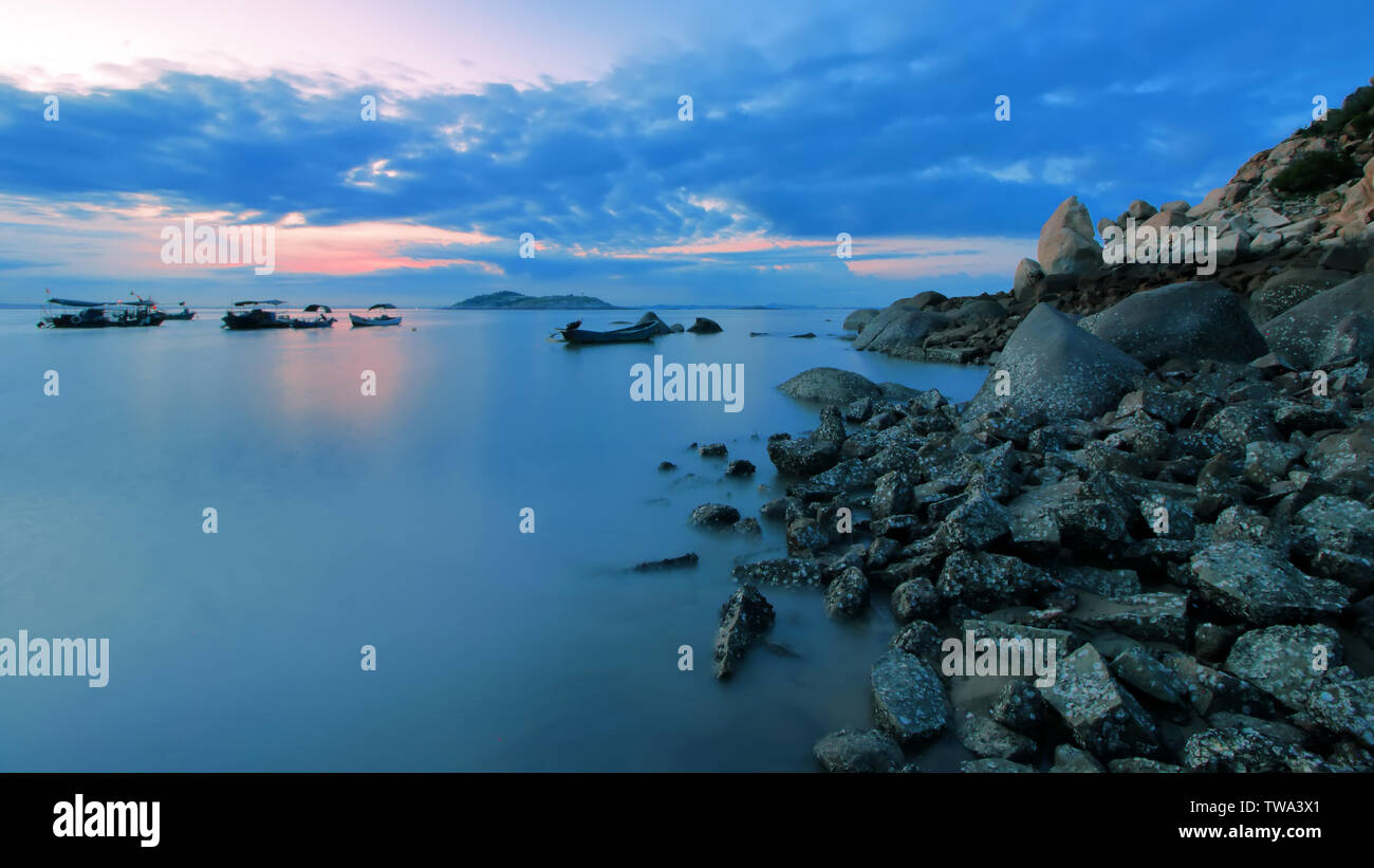 Chongwu Dayuan beach sunset Stock Photo - Alamy
