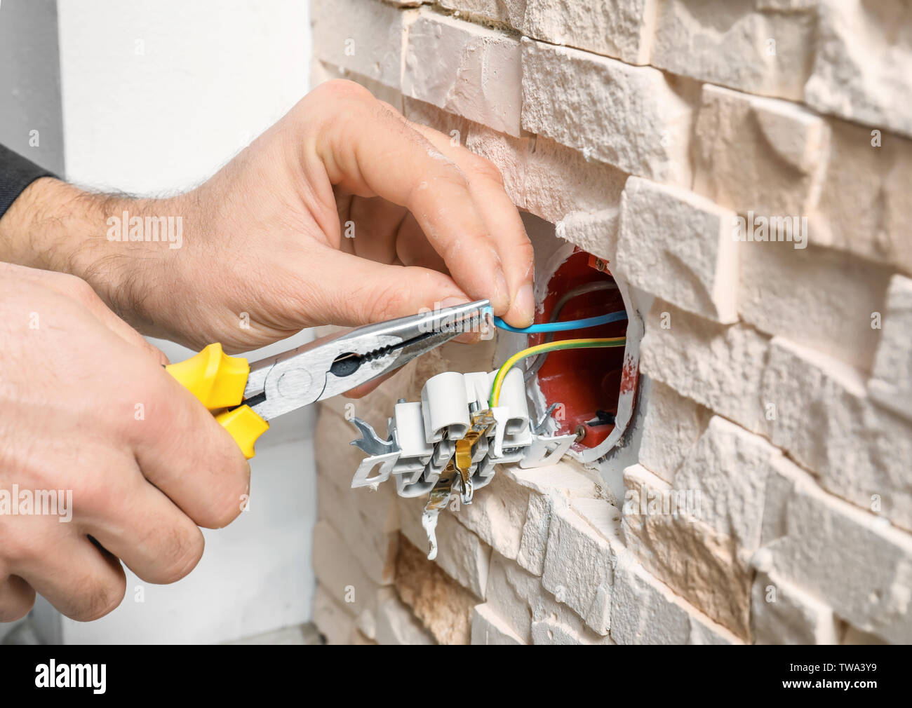 Attaching wires to wall hi-res stock photography and images - Alamy