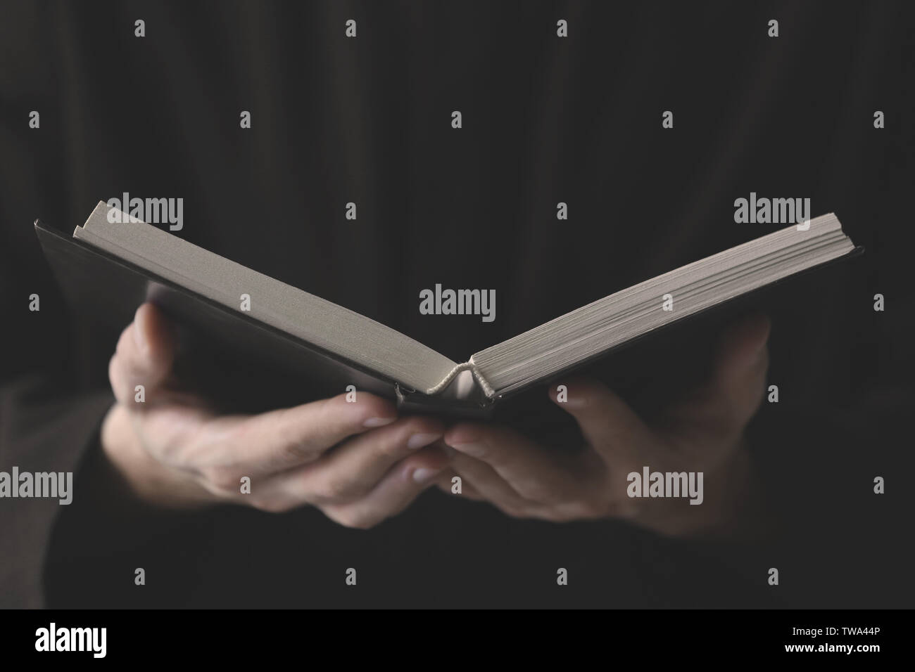 Priest reading bible hi-res stock photography and images - Alamy