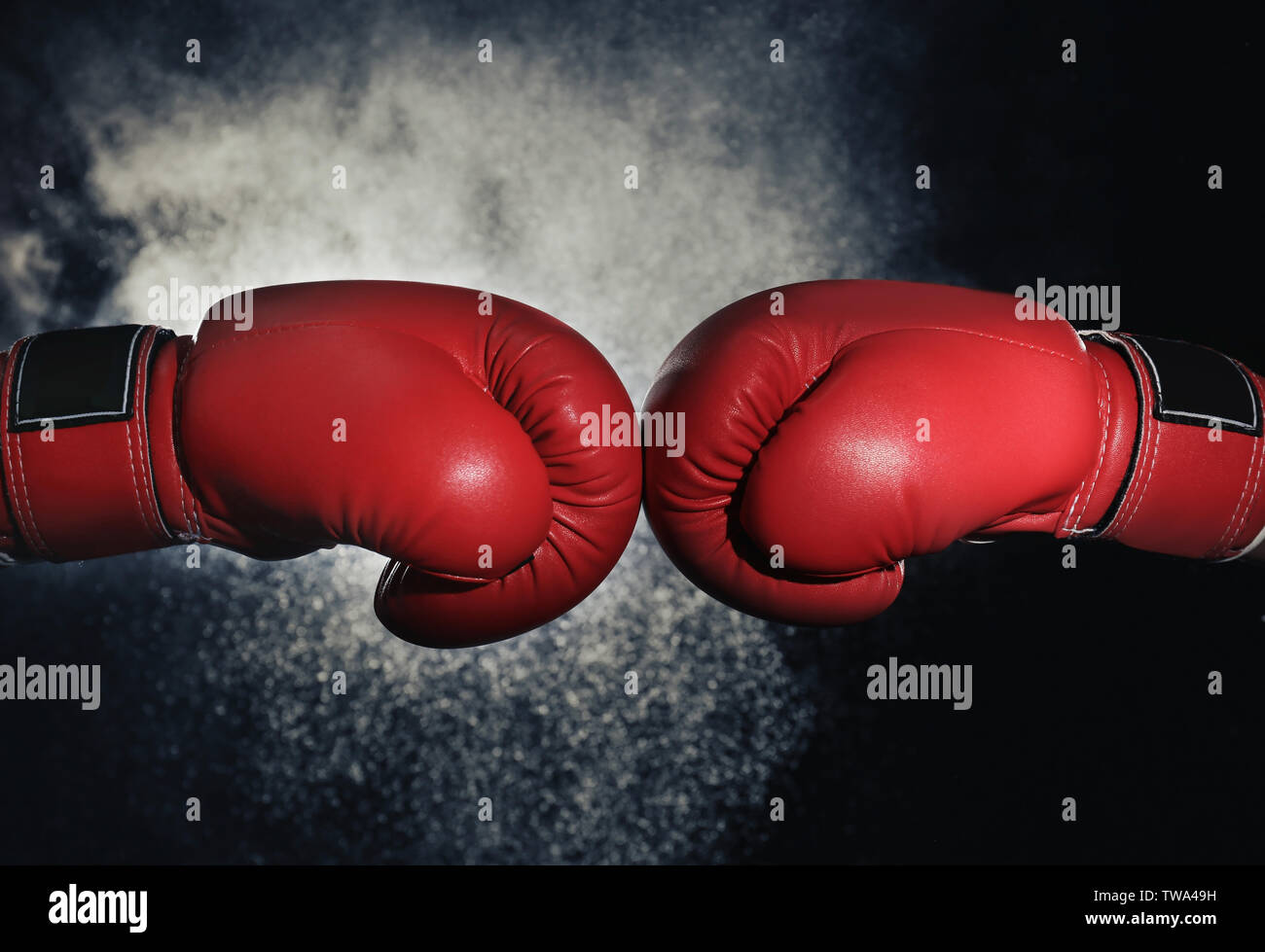 Men in boxing gloves on black background Stock Photo - Alamy