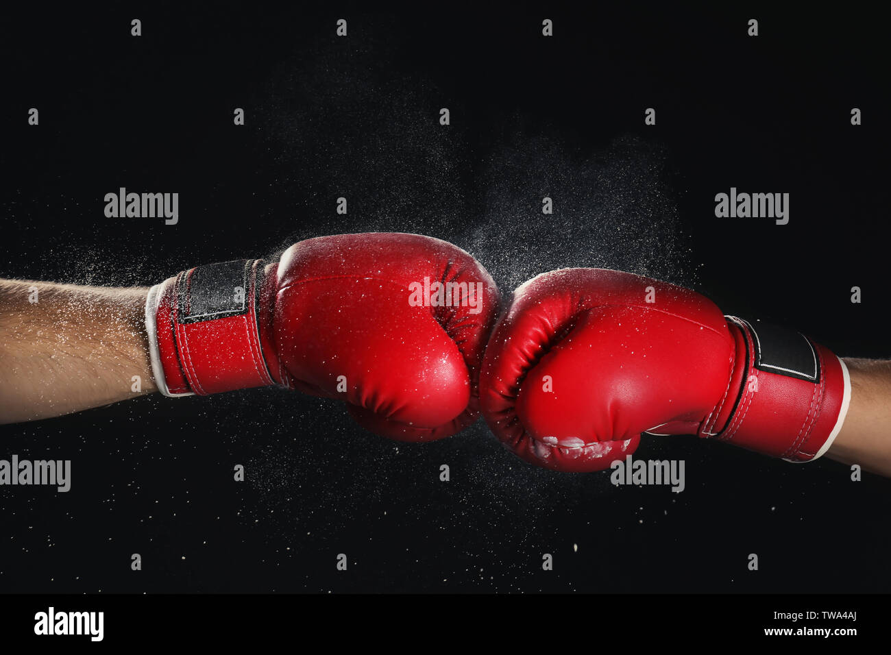 Men in boxing gloves on black background Stock Photo - Alamy