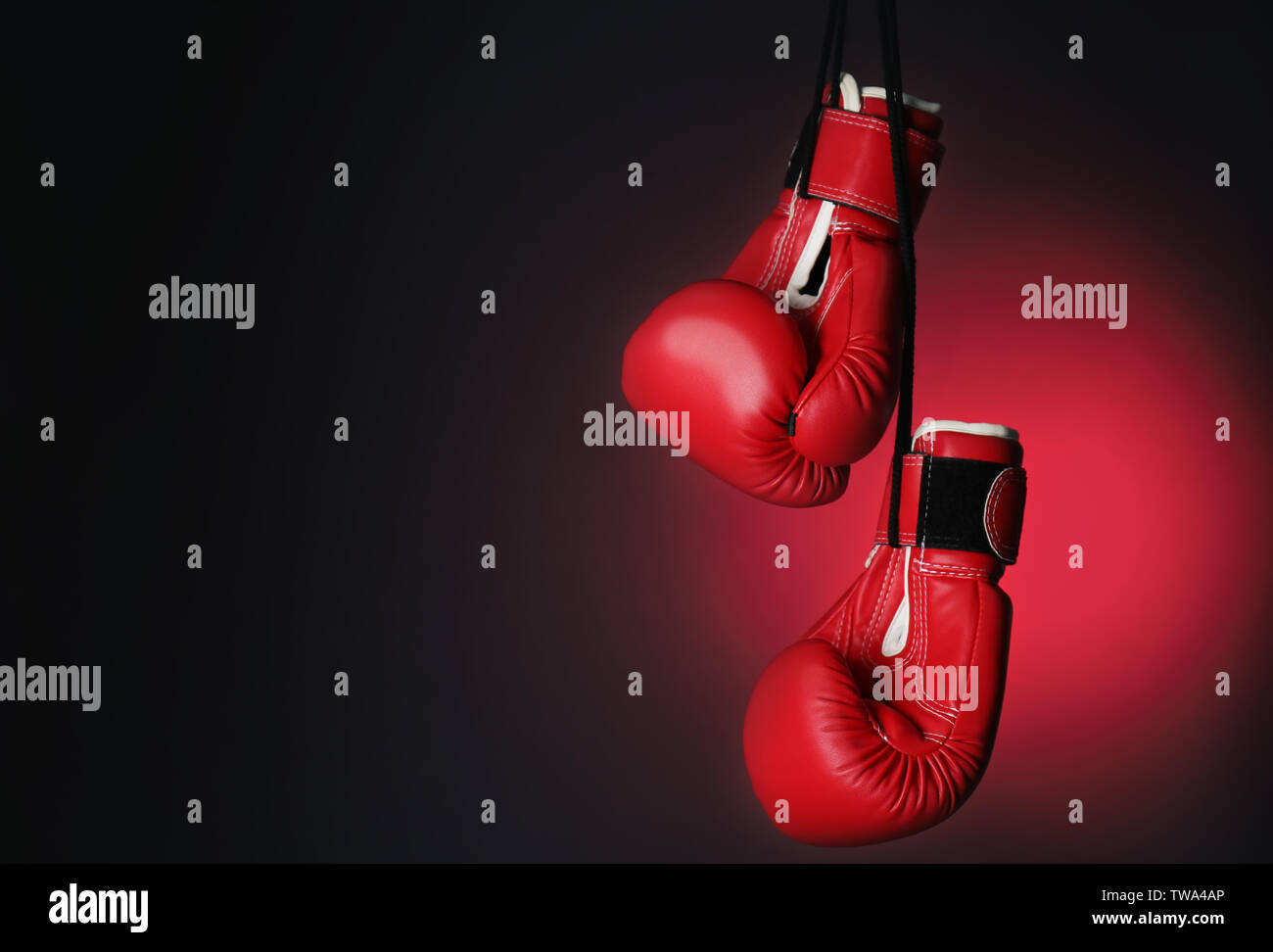 Boxing gloves on dark background Stock Photo - Alamy