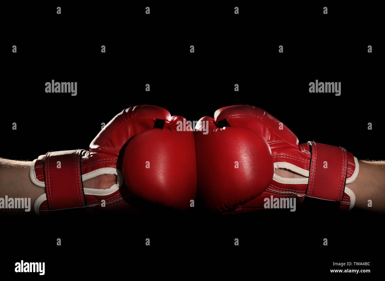 Men in boxing gloves on black background Stock Photo - Alamy