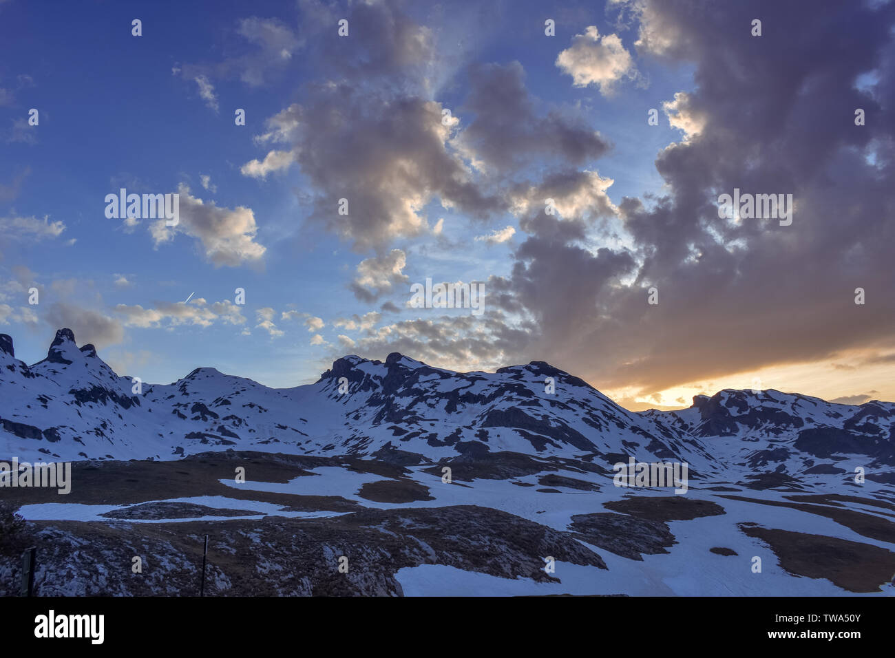 Half snowy mountain landscape at sunset in Pyrenees, Spain Stock Photo ...