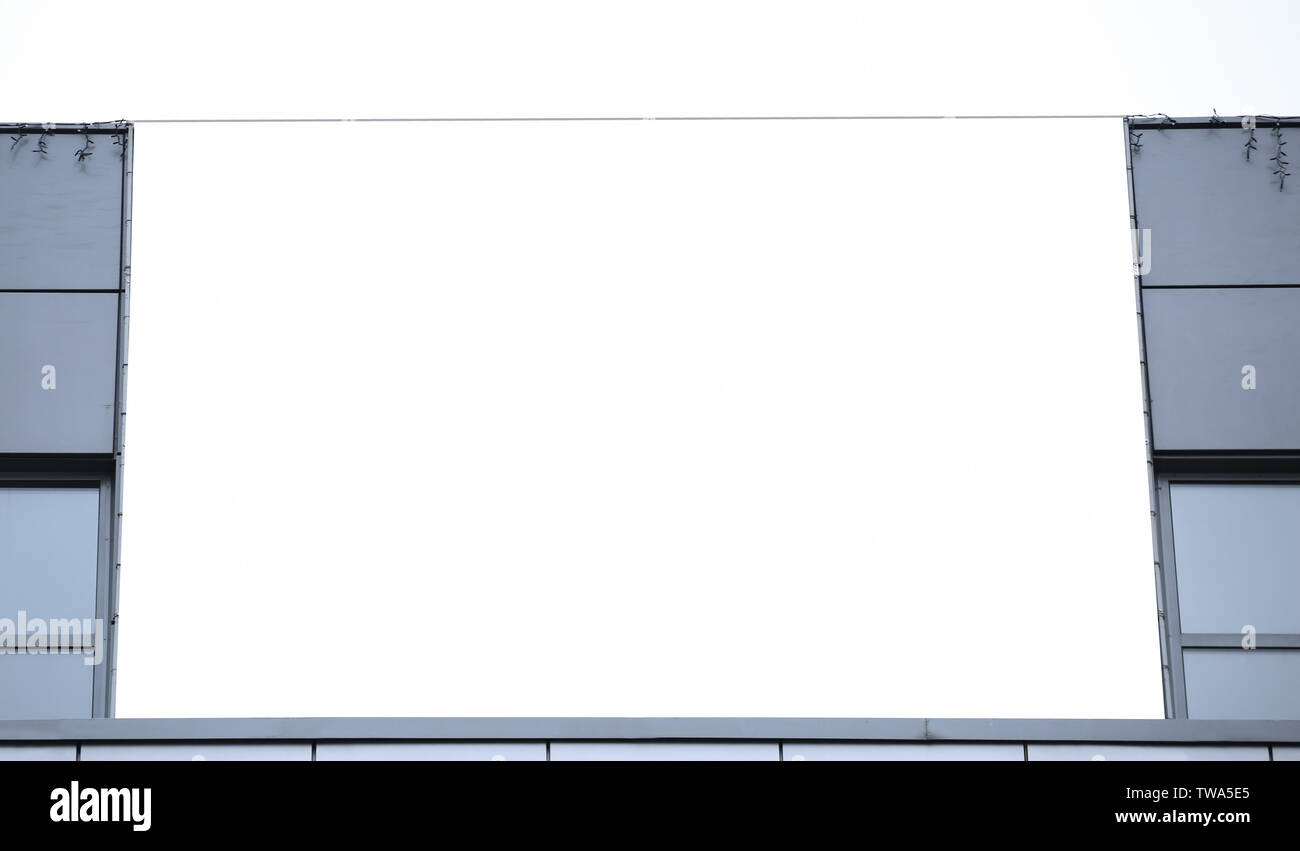 Blank advertising board on city building outdoors Stock Photo - Alamy