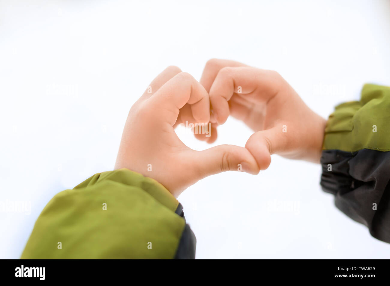Child hand making heart hi-res stock photography and images - Alamy