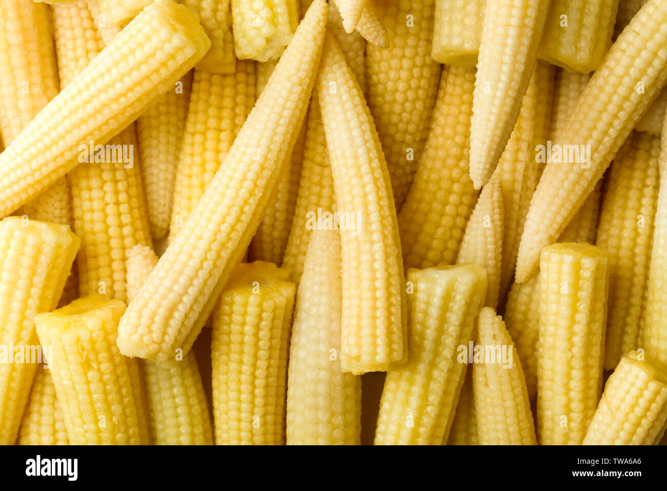 Fresh young baby corn as background Stock Photo - Alamy