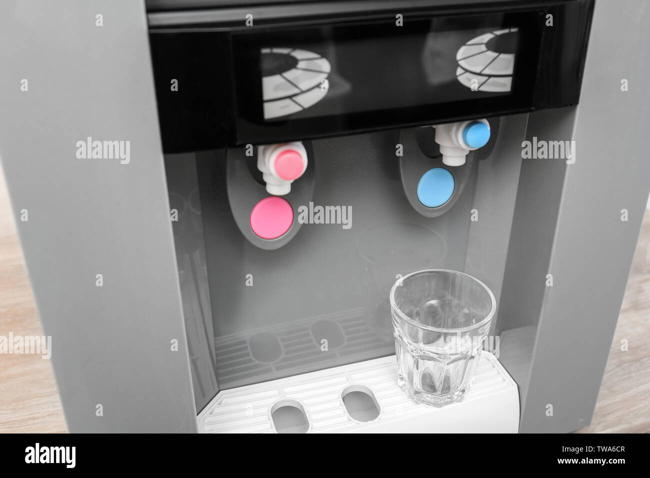 Office water cooler with glass, closeup Stock Photo - Alamy