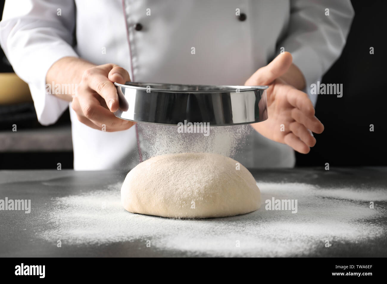 Bakery man sifting wheat hi-res stock photography and images - Alamy