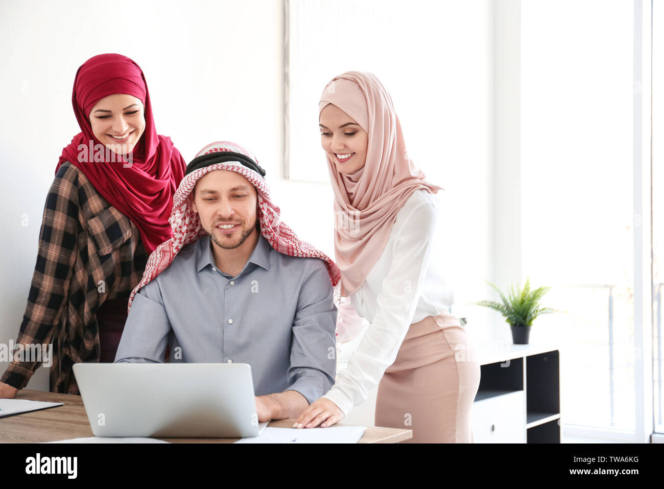 Muslim businessman with coworkers in office Stock Photo - Alamy