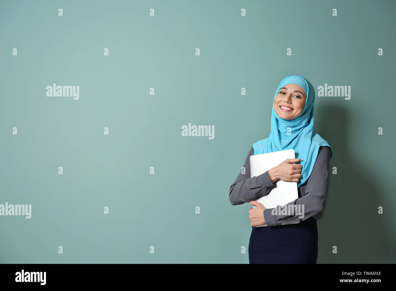 Muslim businesswoman in traditional clothes on color background Stock ...