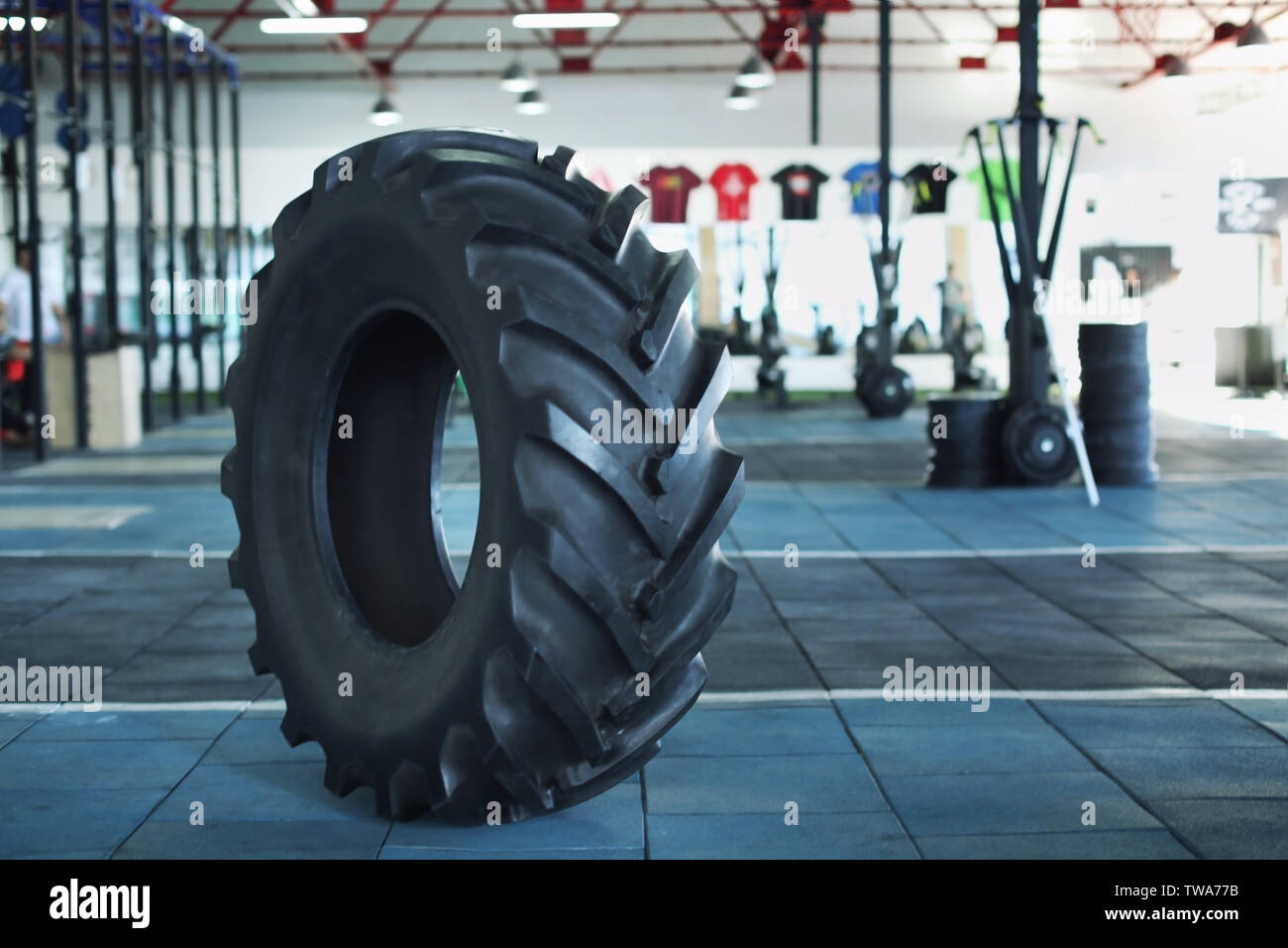 Heavy tire for training in gym Stock Photo - Alamy