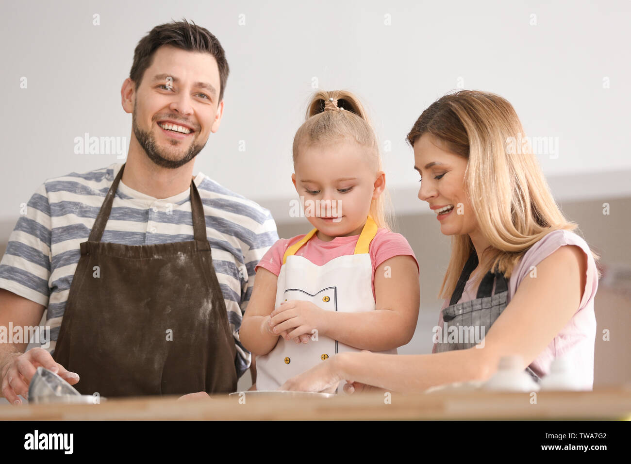 Happy family with flour together in kitchen Stock Photo - Alamy