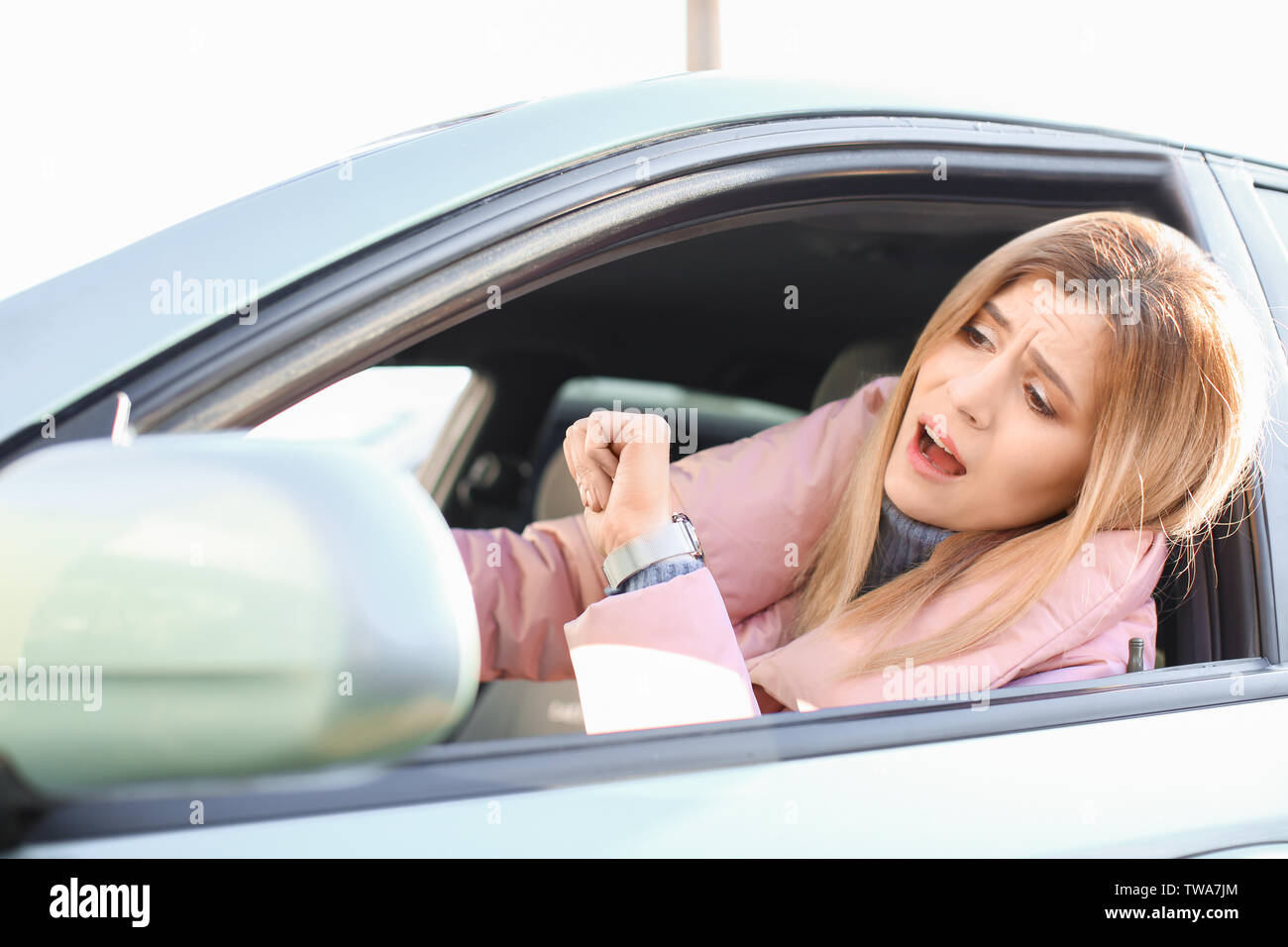 Emotional woman inside car in traffic jam Stock Photo - Alamy