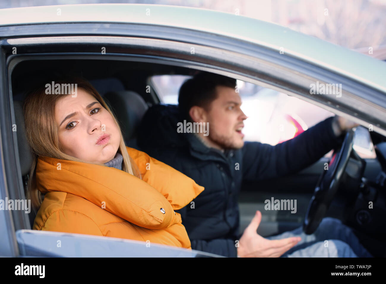 Emotional couple inside car in traffic jam Stock Photo - Alamy